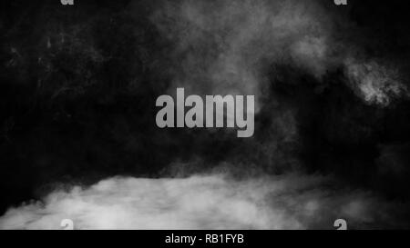 Rolling billows of smoke mist clouds from dry ice across the bottom ...