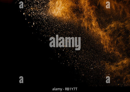 Abstract orange paint Holi. Abstract orange powder explosion on black ...