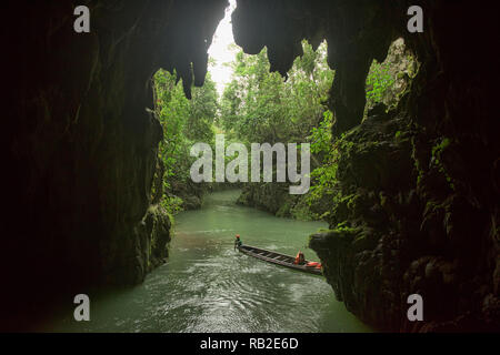 Boat heading into the Lussok Cave and underground river, Luna, Apayao ...