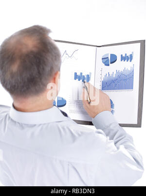 Rear view of businessman looking and analyzing data at multiple ...