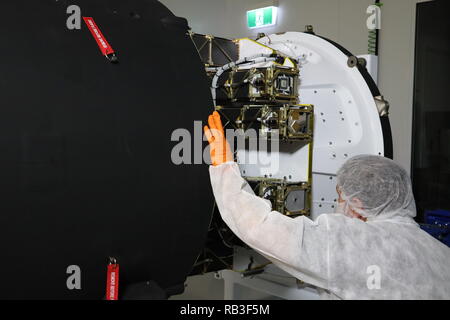A technician loads the Educational Launch of Nanosatellites 19 payload ...