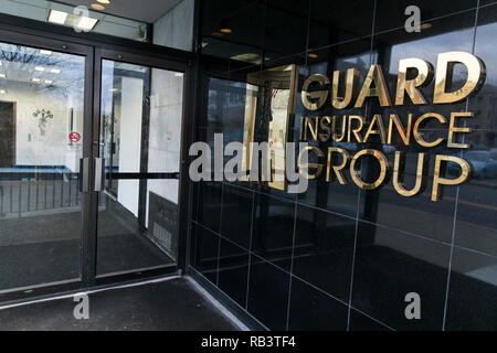 A logo sign outside of the headquarters of the GUARD Insurance Group in ...