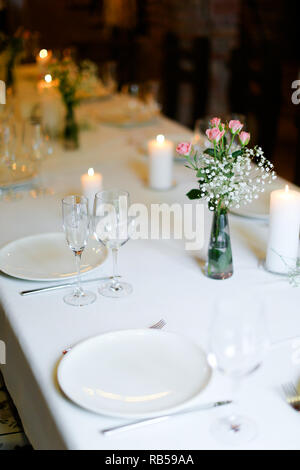 Beautiful candles with flowers on wooden background Stock Photo - Alamy