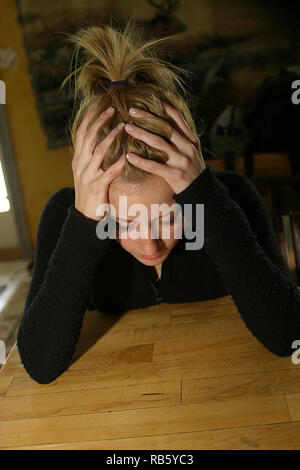 Really stressed out blonde girl having a bad day Stock Photo - Alamy
