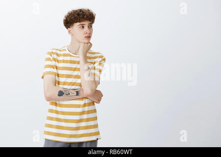 Portrait of gloomy and sad caucasian man in christmas sweater, frowning ...