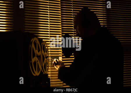 Secret agent secretly eavesdropping directional microphone pushing the ...