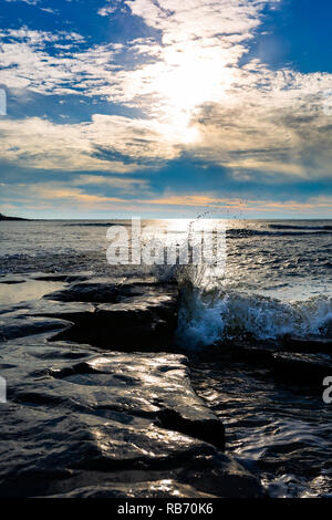 Coast rocks splashed by sea waves Stock Photo - Alamy