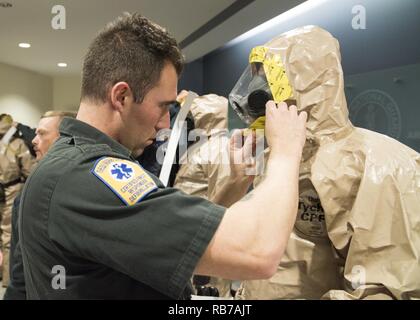 Radiation emergency response training. Fire service trainer showing how ...