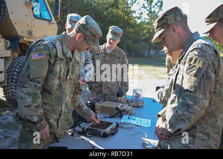 Staff Sgt. Christopher Krueger (left), an intelligence analyst assigned ...