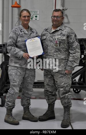 Chief Master Sgt. Mitch Mozingo recieves a letter of appreciation from ...