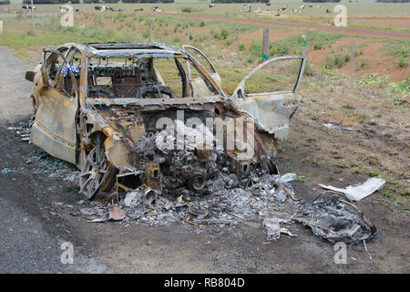 A Holden Commodore torched after a joyride Stock Photo - Alamy