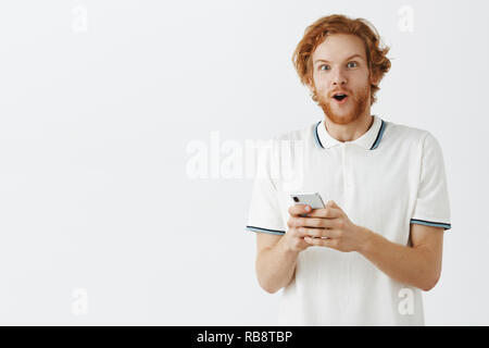 Indoor shot of impressed speechless attractive fair-haired female ...