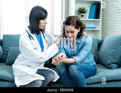 Upset patient crying while doctor comforting her Stock Photo - Alamy