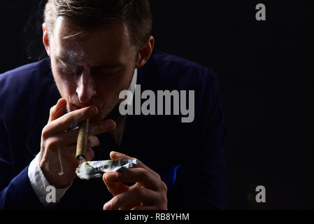Rich businessman with cigar Stock Photo - Alamy