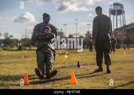 A Marine with Marine Forces Reserve conducts a fireman carry during the ...