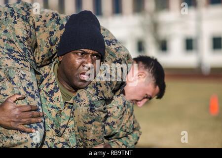 A Marine with Marine Forces Reserve conducts a fireman carry during the ...