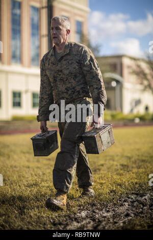 A Marine with Marine Forces Reserve sprints with two ammo cans during ...