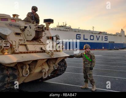 BREMERHAVEN, Germany – Pfc. Traven Friend (left), a tank mechanic, and ...