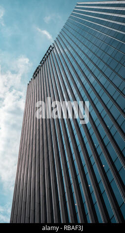 High-rise building with glass curtain wall in city business district ...