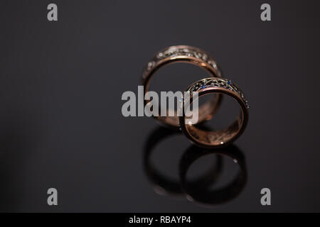 Two wedding rings in infinity sign. Love concept Stock Photo - Alamy