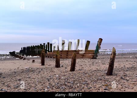 metal beach groynes sea defences on caister beach Stock Photo ...