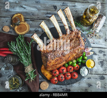 grilled meat with rosemary on a wooden board Stock Photo - Alamy