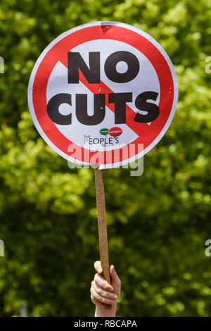30th May, 2015. Protesters carrying anti-austerity placards are ...