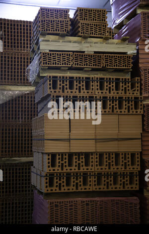 Bricks in a heap to wall Stock Photo - Alamy