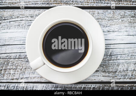 Top view of hot cappuccino coffee cup on wood table at cafe,food and ...