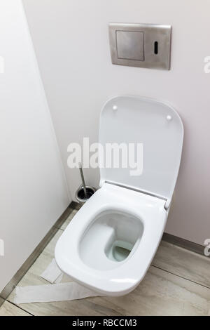 Clean empty toilet cubicle with open door in public restroom Stock ...