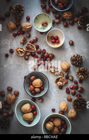 Composition with bowl of dried cranberries on wooden table Stock Photo ...