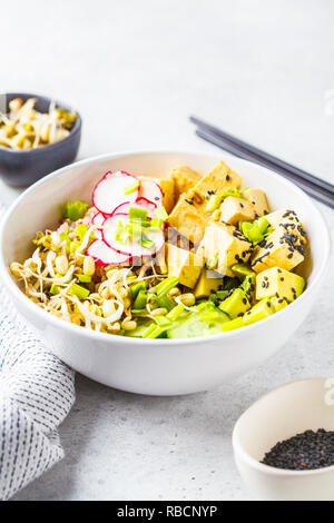 Poke bowl with silken tofu, seaweed, rice and vegetables Stock Photo ...