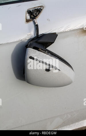 Dented bodywork of a damaged car wing, with steel crushed after a ...
