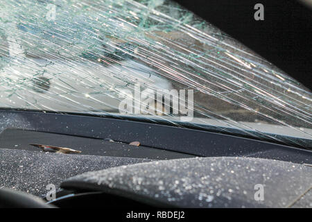 Dented bodywork of a damaged car wing, with steel crushed after a ...