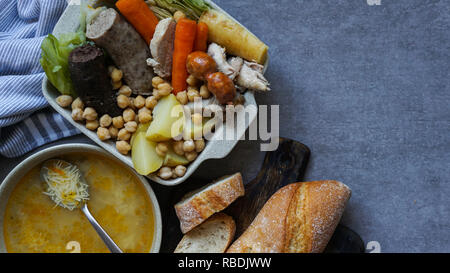 Cocido, traditional chickpea-based stew from Madrid. on the grey stone ...