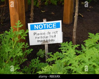 "Please do not pick...." sign on garden water tap Stock Photo - Alamy