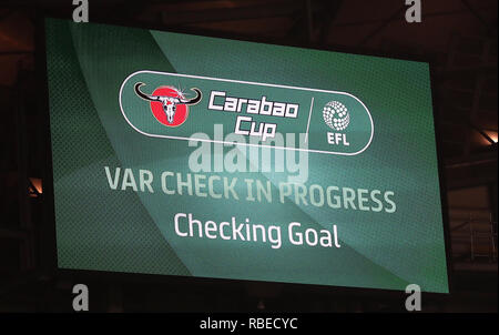 The electronic scoreboard shows VAR decision of goal, no handball, with ...