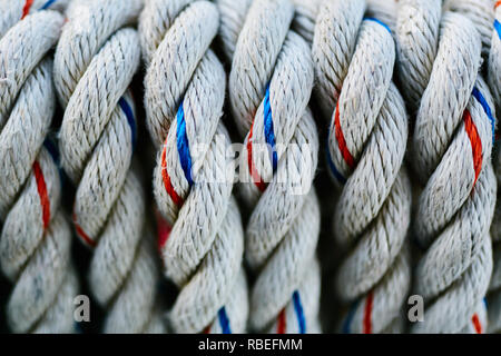 marine ropes hanging over railing Stock Photo - Alamy
