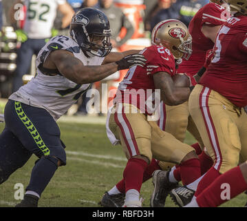 Seattle Seahawks defensive end Michael Bennett (72) watches his team ...
