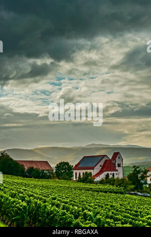 Photovoltaic panels on the church roof in Alsace, France. Religion and ...
