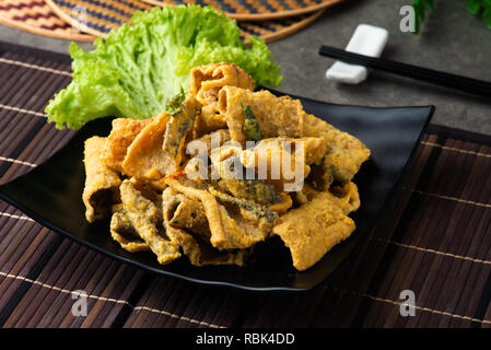 Crispy fried fish Skin with salted egg Stock Photo - Alamy