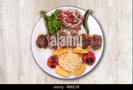 kebab plate on wooden floor S Stock Photo - Alamy