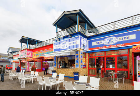 A view of the seafront shops and amusement arcade at Mundesley-on-Sea ...