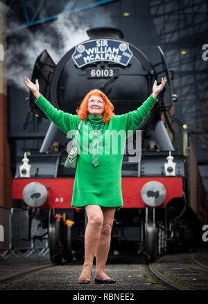 Lady Judy McAlpine stands in front of the Flying Scotsman, that has ...
