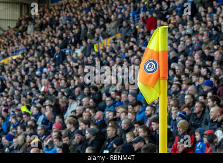 Portsmouth fans in the Fratton End stand hold up cards to display the ...