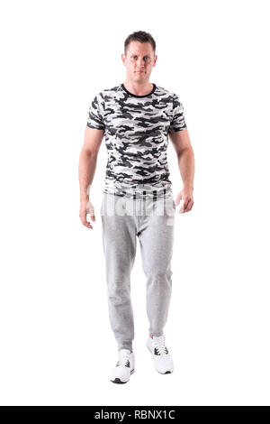 Front view of an angry man walking towards camera in the street Stock ...