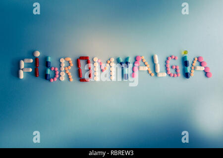 The word Fibromyalgia written by colorful medicines, pills, drugs ...