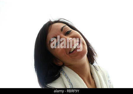 Happy lady throwing her head back while being in arms of boyfriend ...