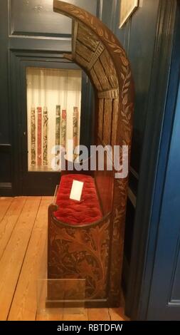 A wooden carved bench by William Morris 02 Stock Photo - Alamy