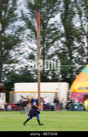 Man tossing the Caber, athlete, athletic, attire, caber toss, clan ...